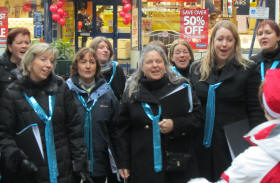 Vocal Dimension Chorus - Singing next to the Christmas tree in Reigate